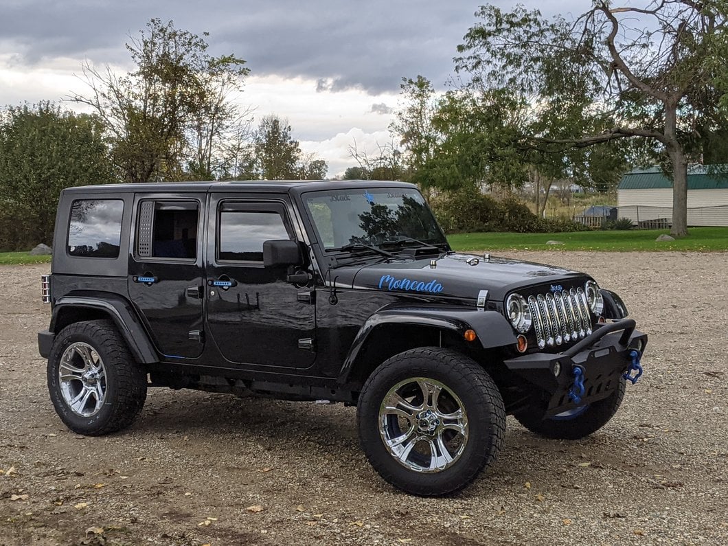 Black jeep wrangler with blue accents store